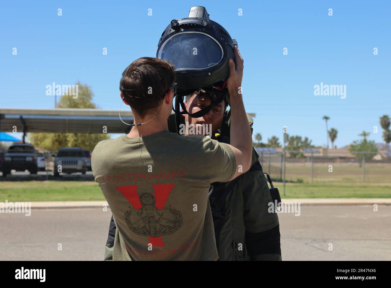 U.S. Marine Corps Sgt. Cameron Scungio, near, assists Sgt. Cory Kim ...