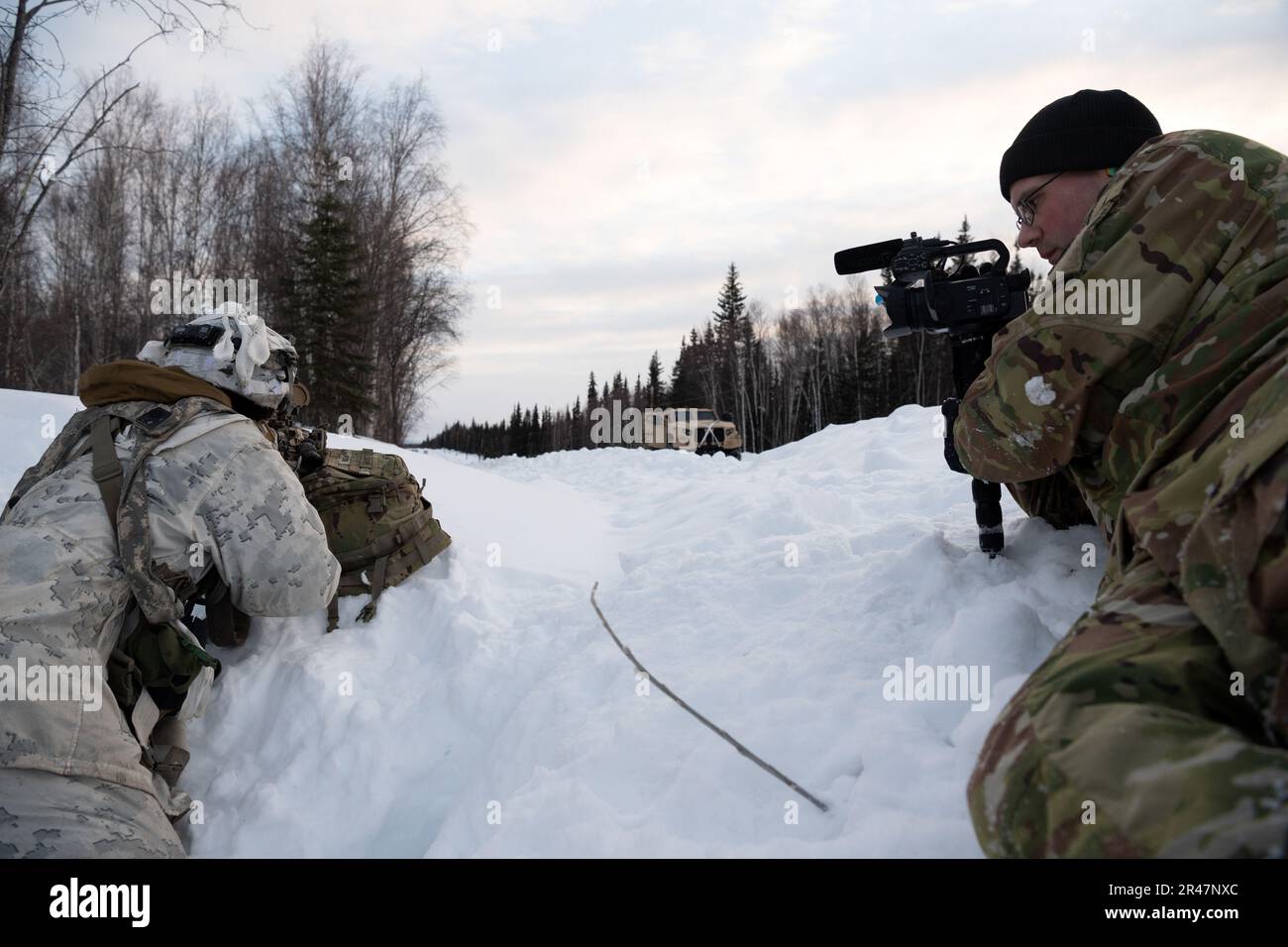 U.S. Air Force Staff Sgt. Michael Pfeiffer, right, a broadcast ...
