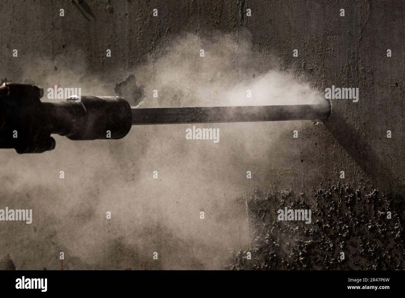 Construction laborers perform work on the chamber floor concrete infill ...