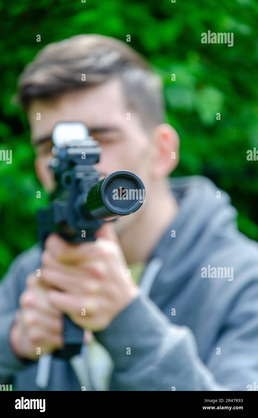 Male shooter hi-res stock photography and images - Alamy