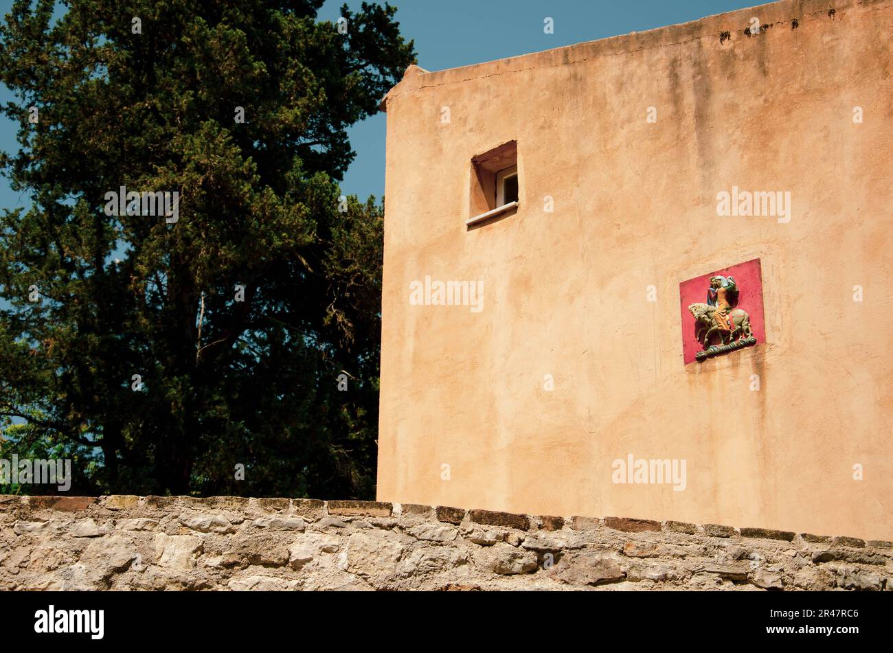 An old aged building surrounded by green trees Stock Photo - Alamy