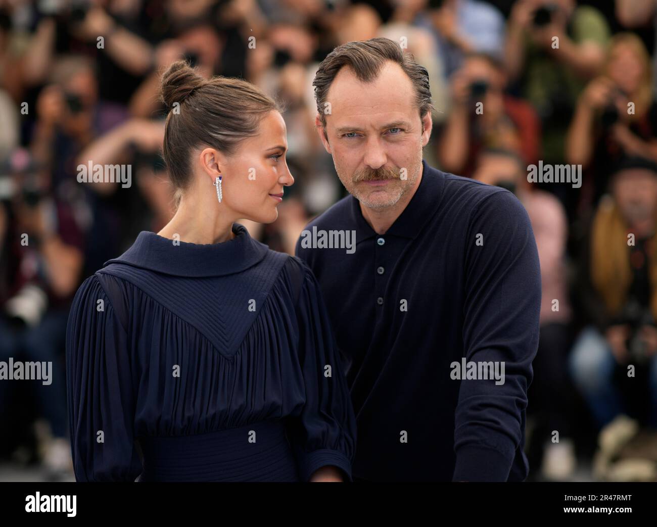 Alicia Vikander, left, and Jude Law pose for photographers at the photo ...