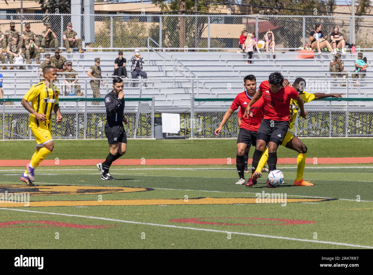 A U.S. Marine with the Marine Corps soccer team defends the ball during ...
