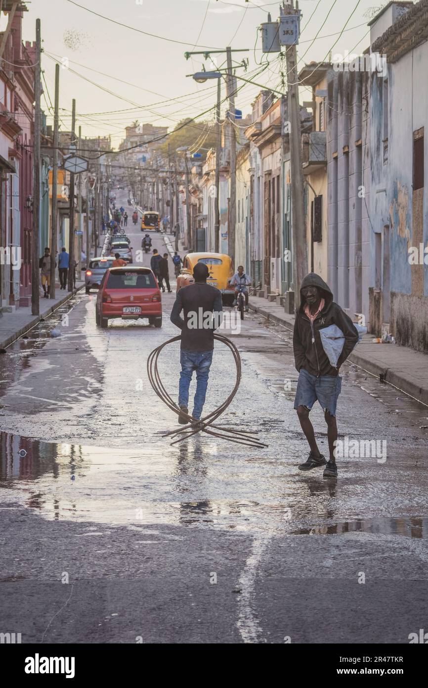An African-American man dragging multiple steel bars in the streets of ...