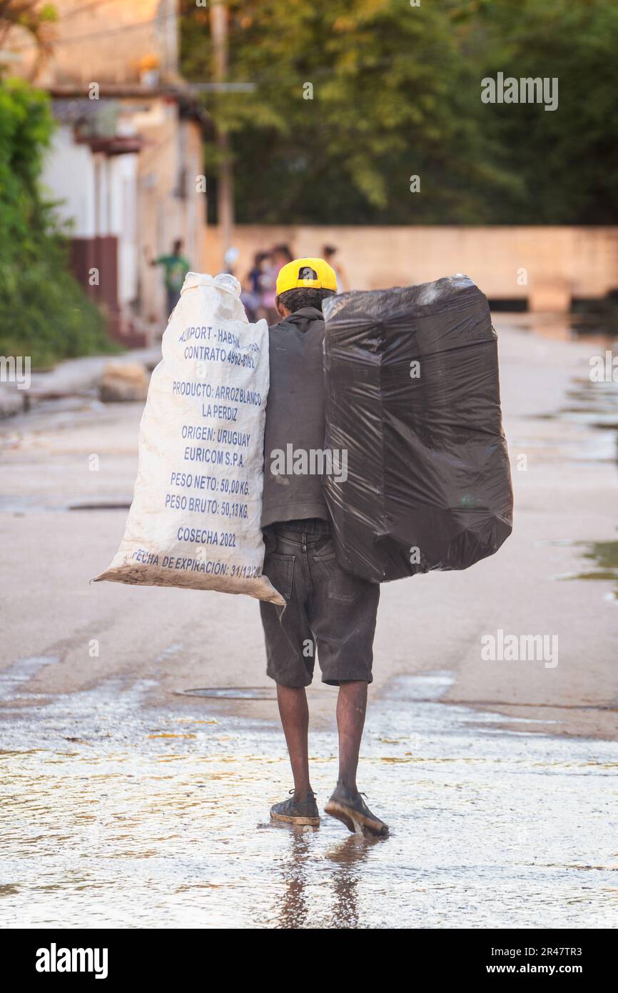 Man carrying large sack hi-res stock photography and images - Alamy