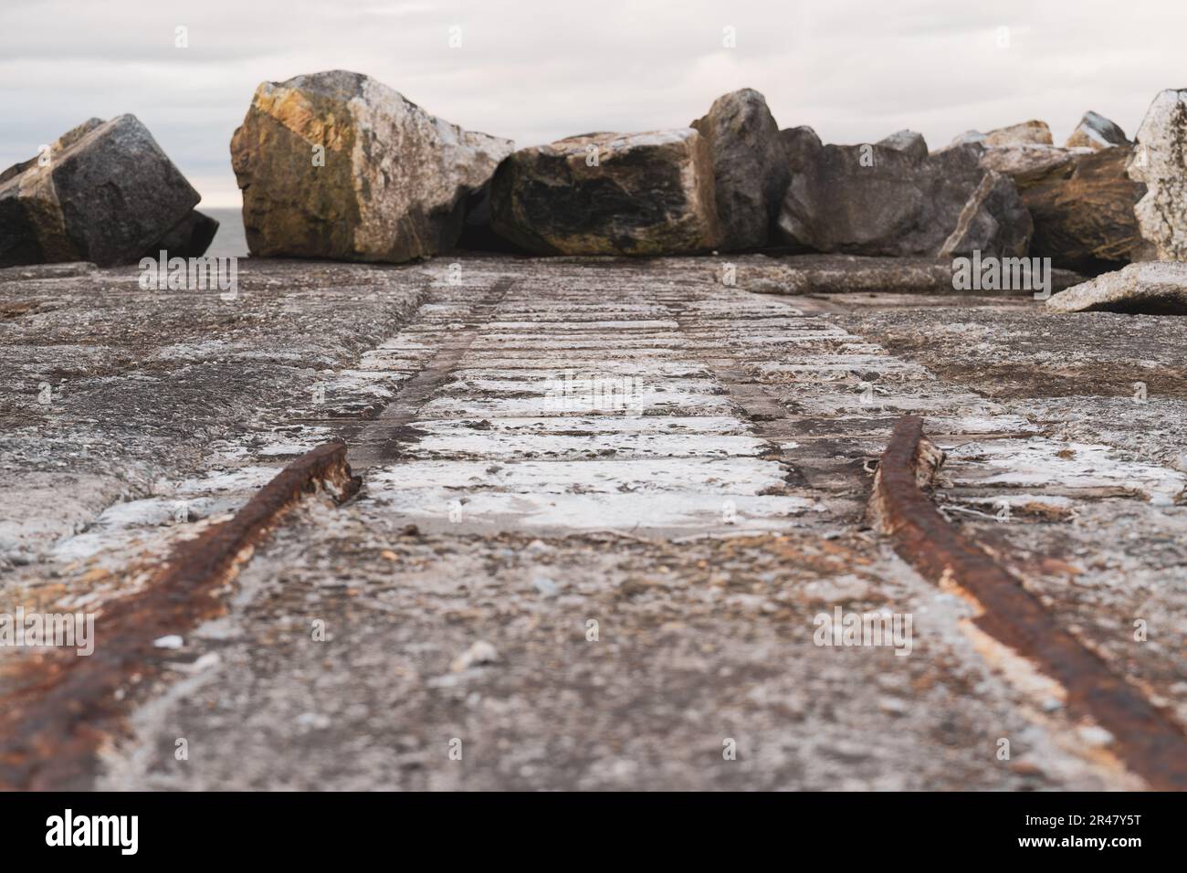 This scenic landscape features a backdrop of large rocks, creating a ...