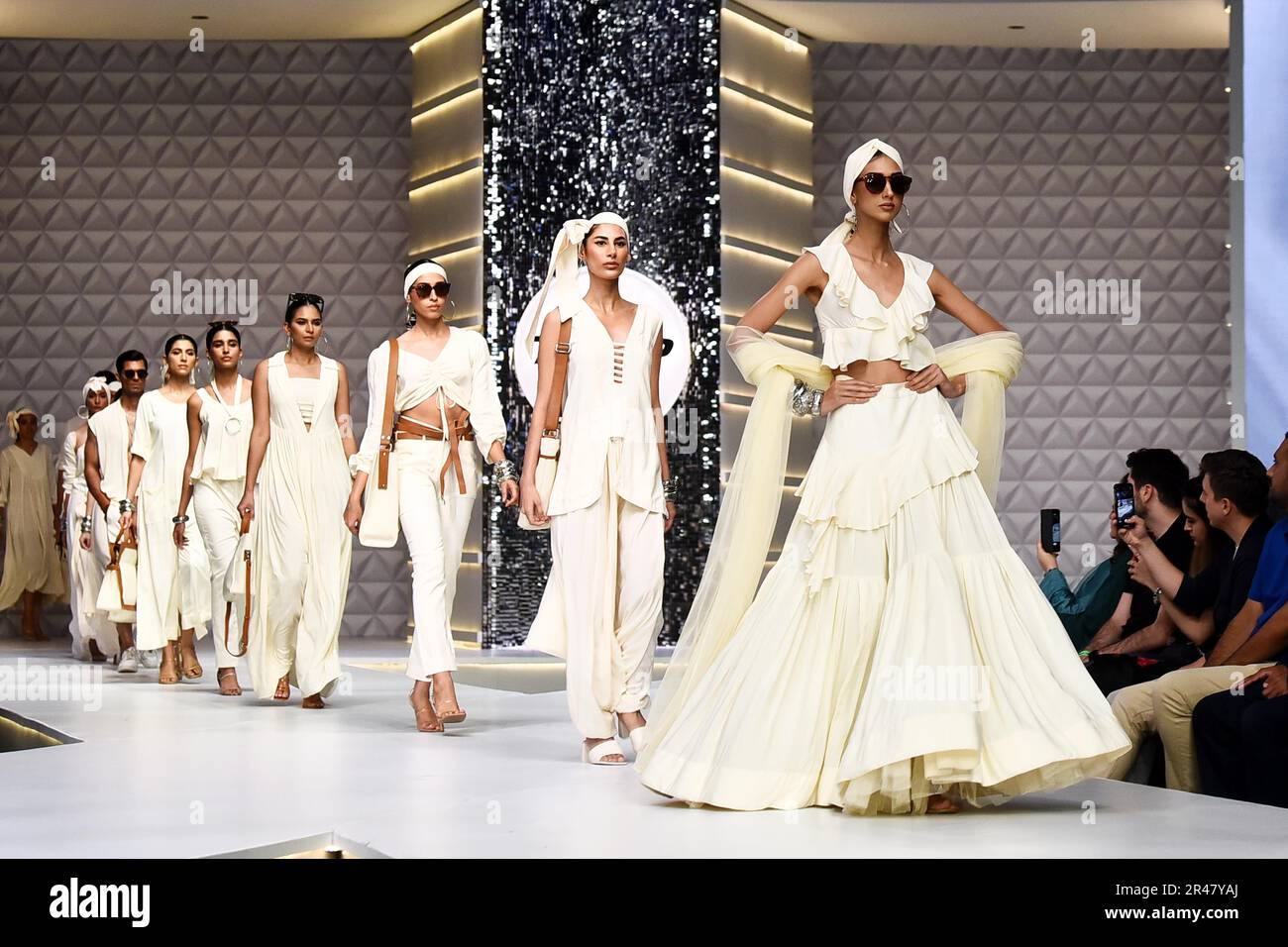 Karachi, Pakistan. 26th May, 2023. Models present creations during a ...