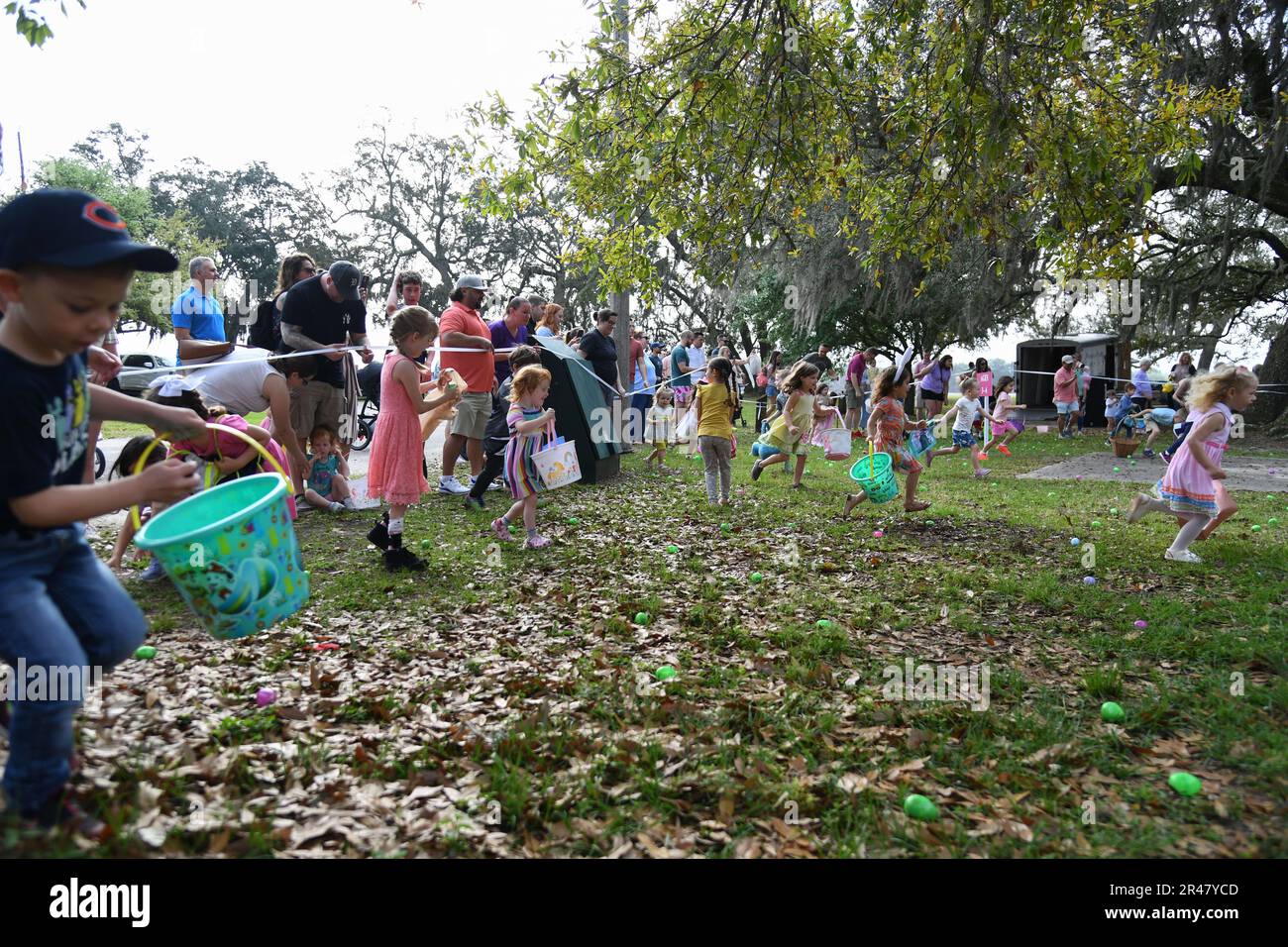 Children of Keesler personnel pick up Easter eggs during Easter in the ...