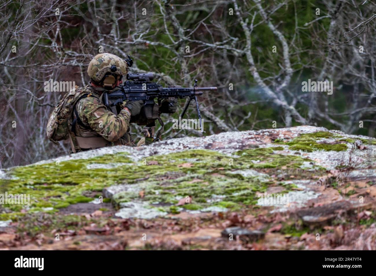 An East-Coast-based U.S. Naval Special Warfare Operator (SEAL) fires at ...