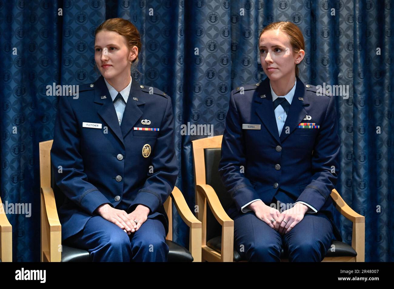 2nd Lts. Hannah Fletcher and Allyson Burba listen to remarks from Air ...
