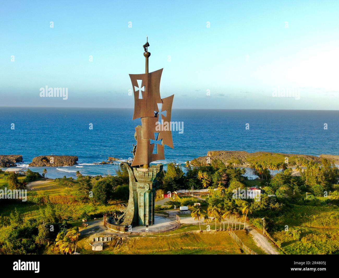 A scenic image of the Statue of Columbus, surrounded by lush green ...