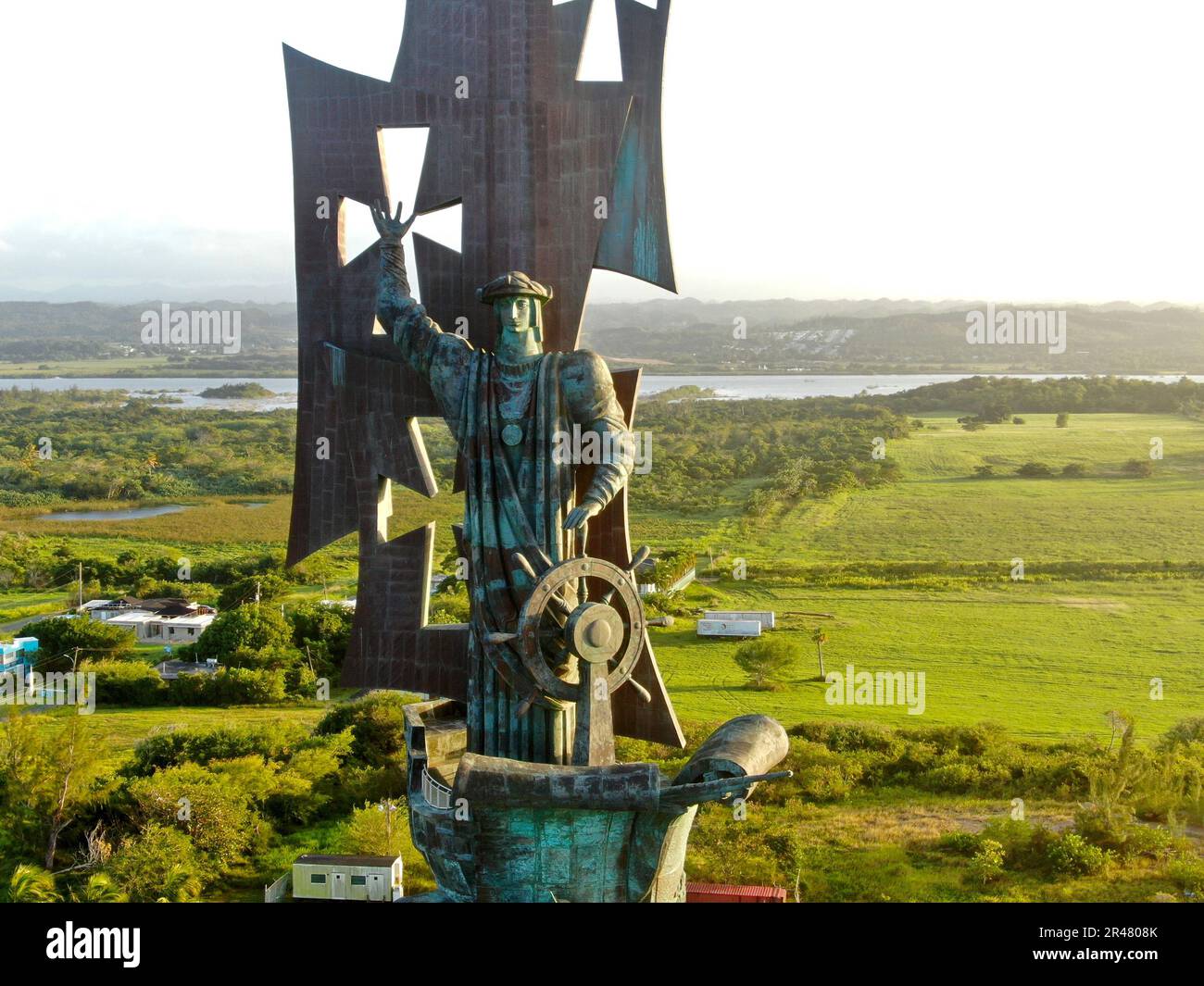 A scenic image of the Statue of Columbus, surrounded by lush green ...