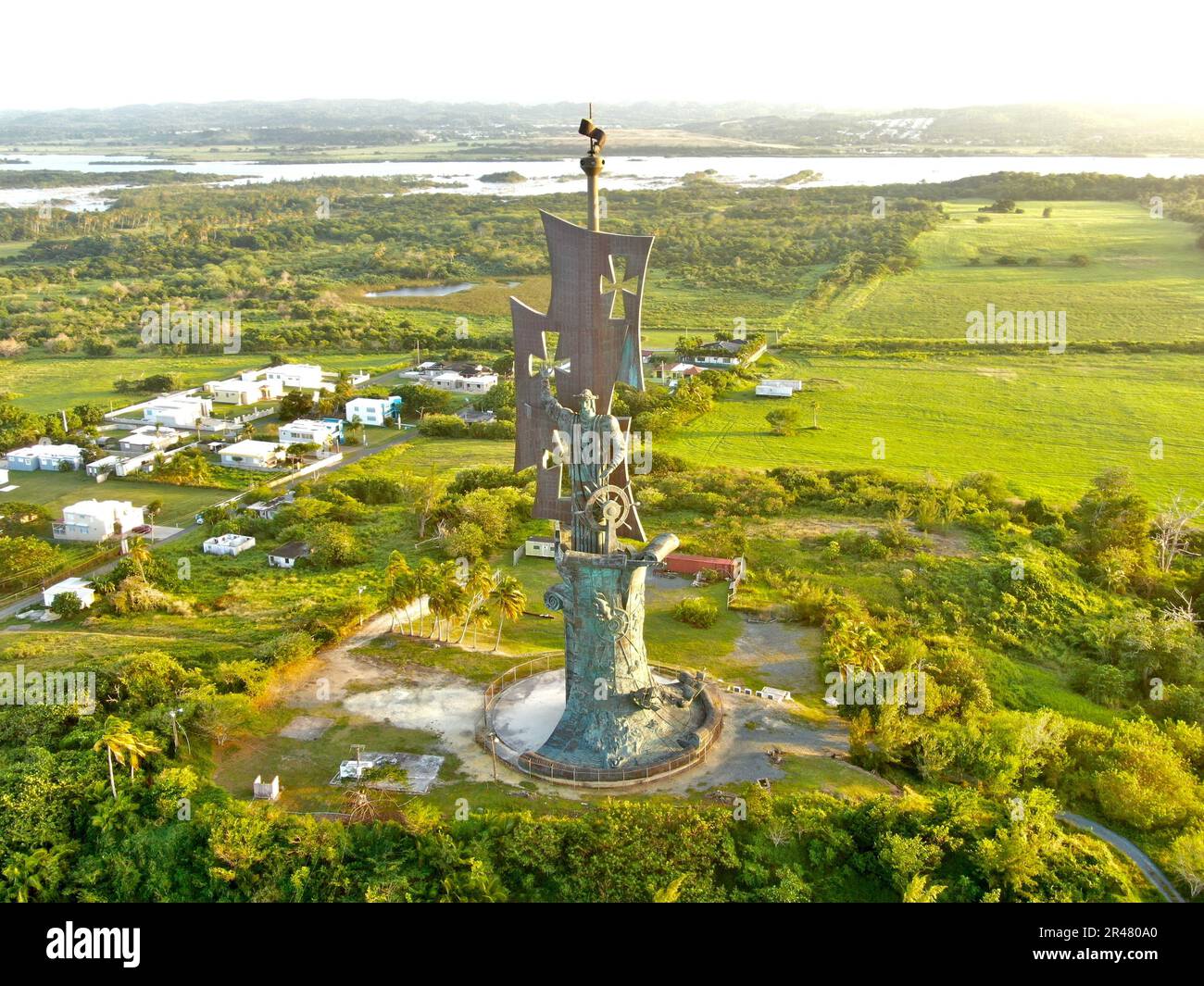 A scenic image of the Statue of Columbus, surrounded by lush green ...