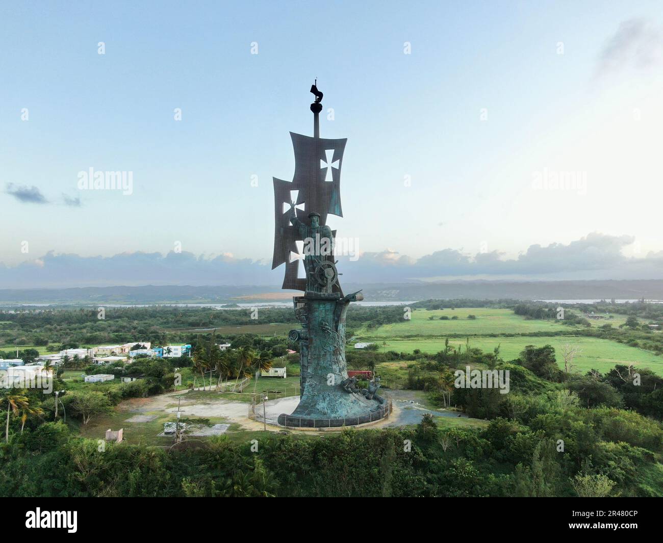 A scenic image of the Statue of Columbus, surrounded by lush green ...