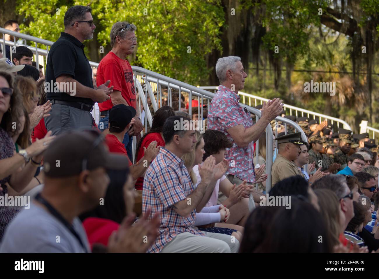 Veterans stand to be recognized in the audience during a morning colors ...