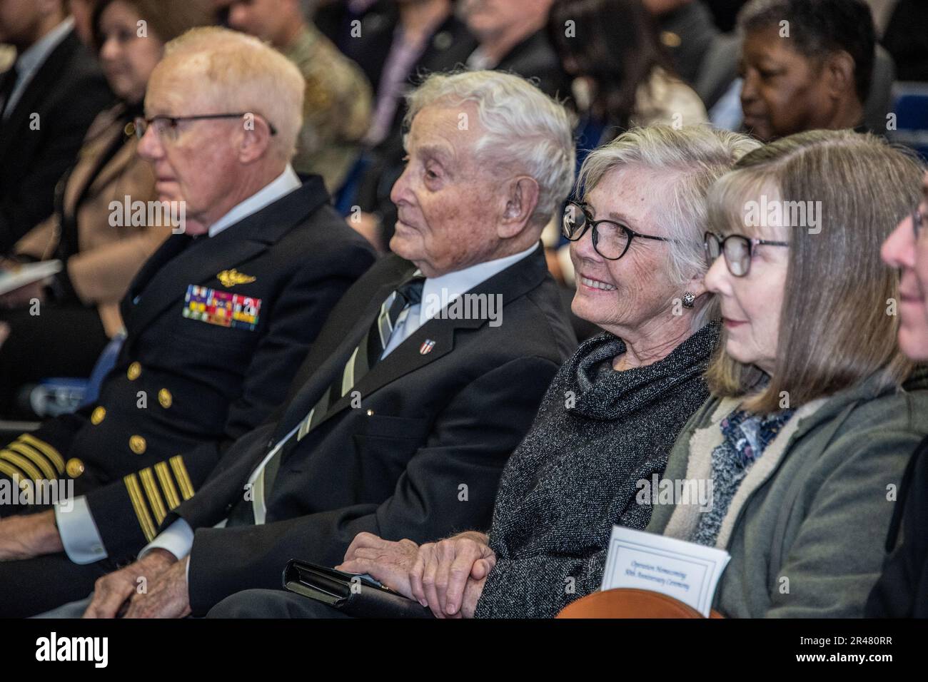 Audience members attend the passenger terminal renaming and flight line ...