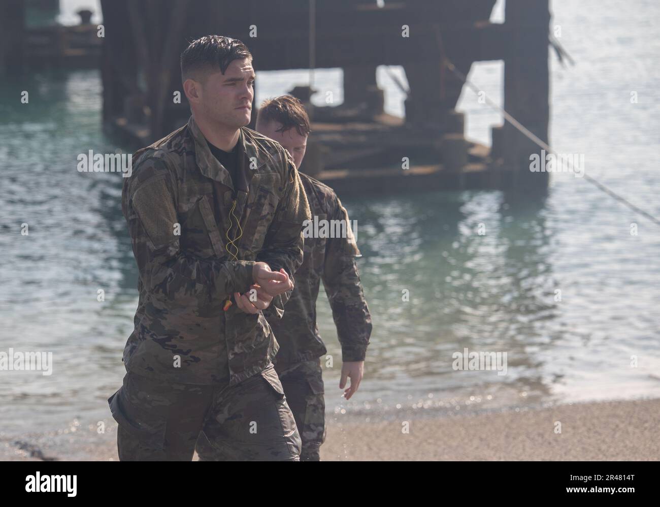 U.S. Army Soldier with the 511th Engineer Dive Detachment walks on the ...