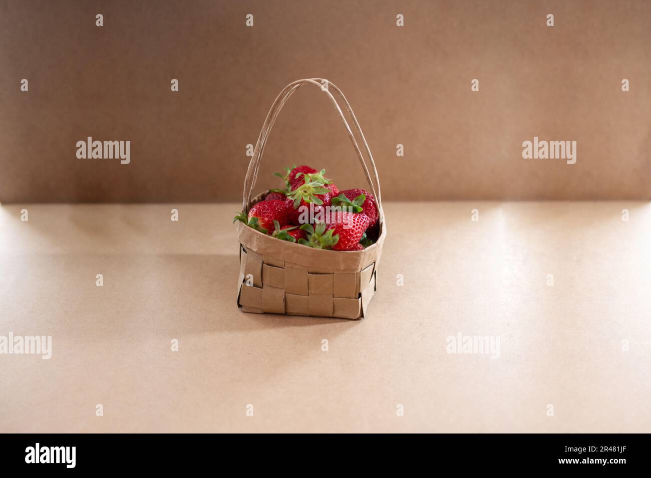 basket paper craft from recycled waste paper bag Stock Photo - Alamy