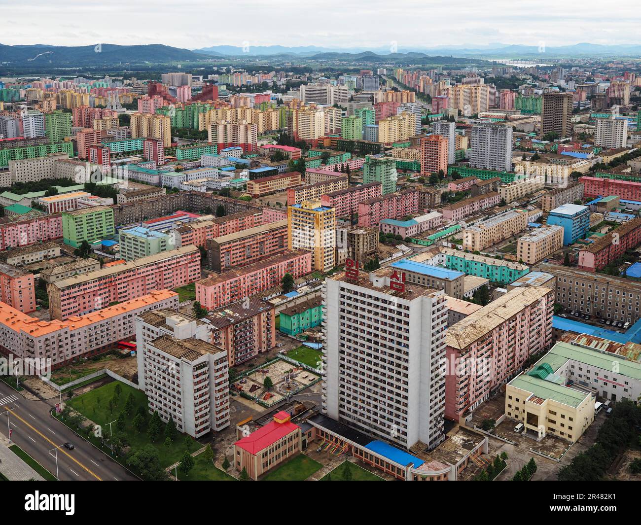 A vibrant cityscape with a multitude of multicolored buildings in ...