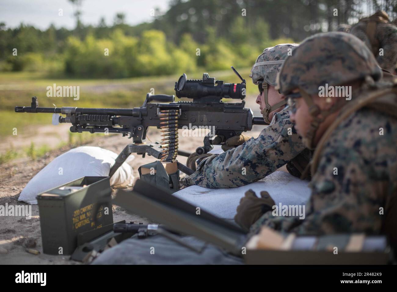 U.S. Marines with 2nd Marine Logistics Group (MLG), fire an M240B machine gun during a live-fire ...