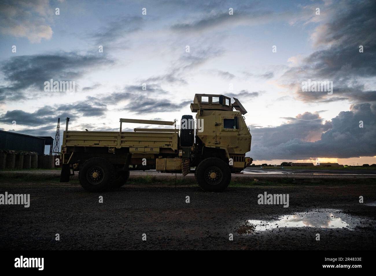 A U.S. Army light medium tactical vehicle (LMTV) parks before a ...