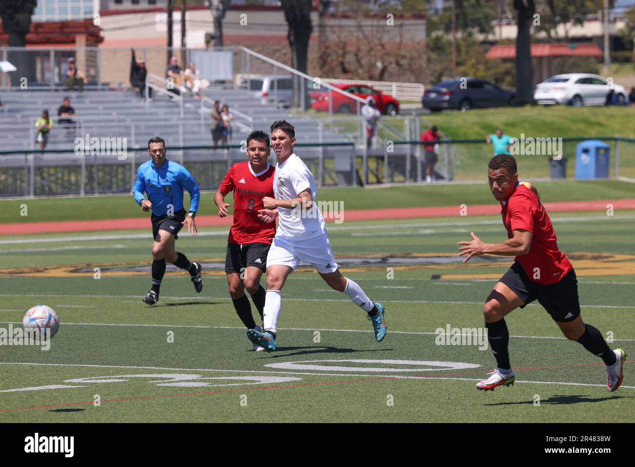 A U.S. Marine with the Marine Corps soccer team runs to the ball during ...
