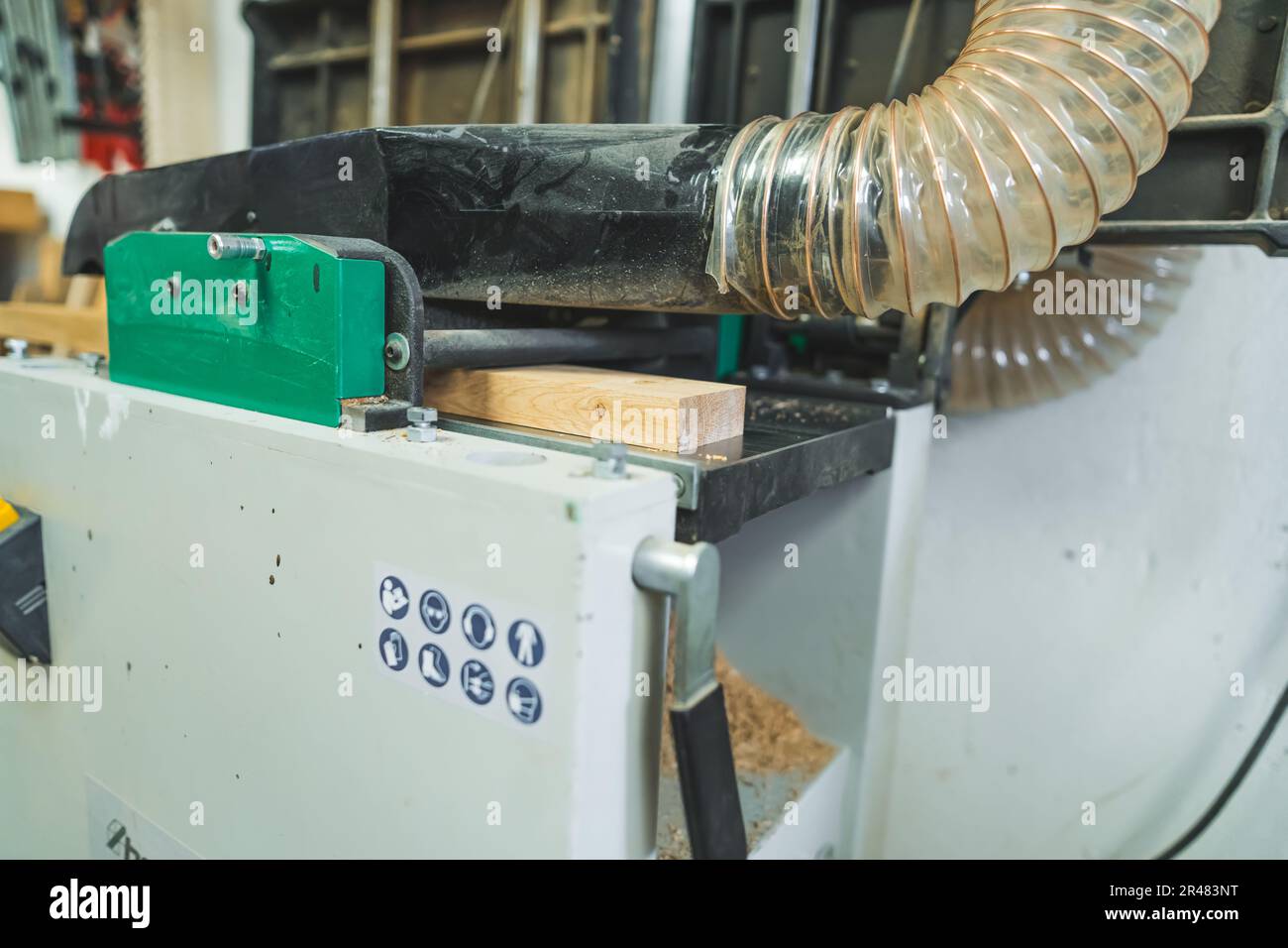 carpenter putting a plank of wood in the vacuum system, carpenter ...