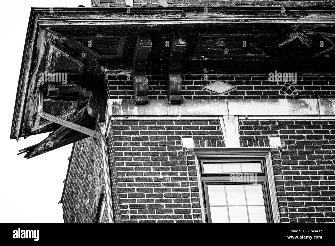 An old brick building exterior in grayscale Stock Photo - Alamy