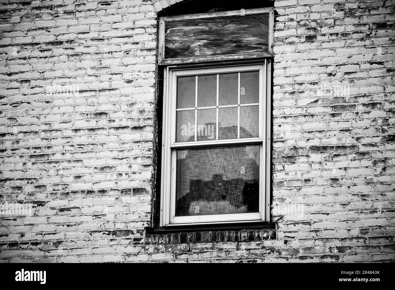 An old brick building exterior in grayscale Stock Photo - Alamy