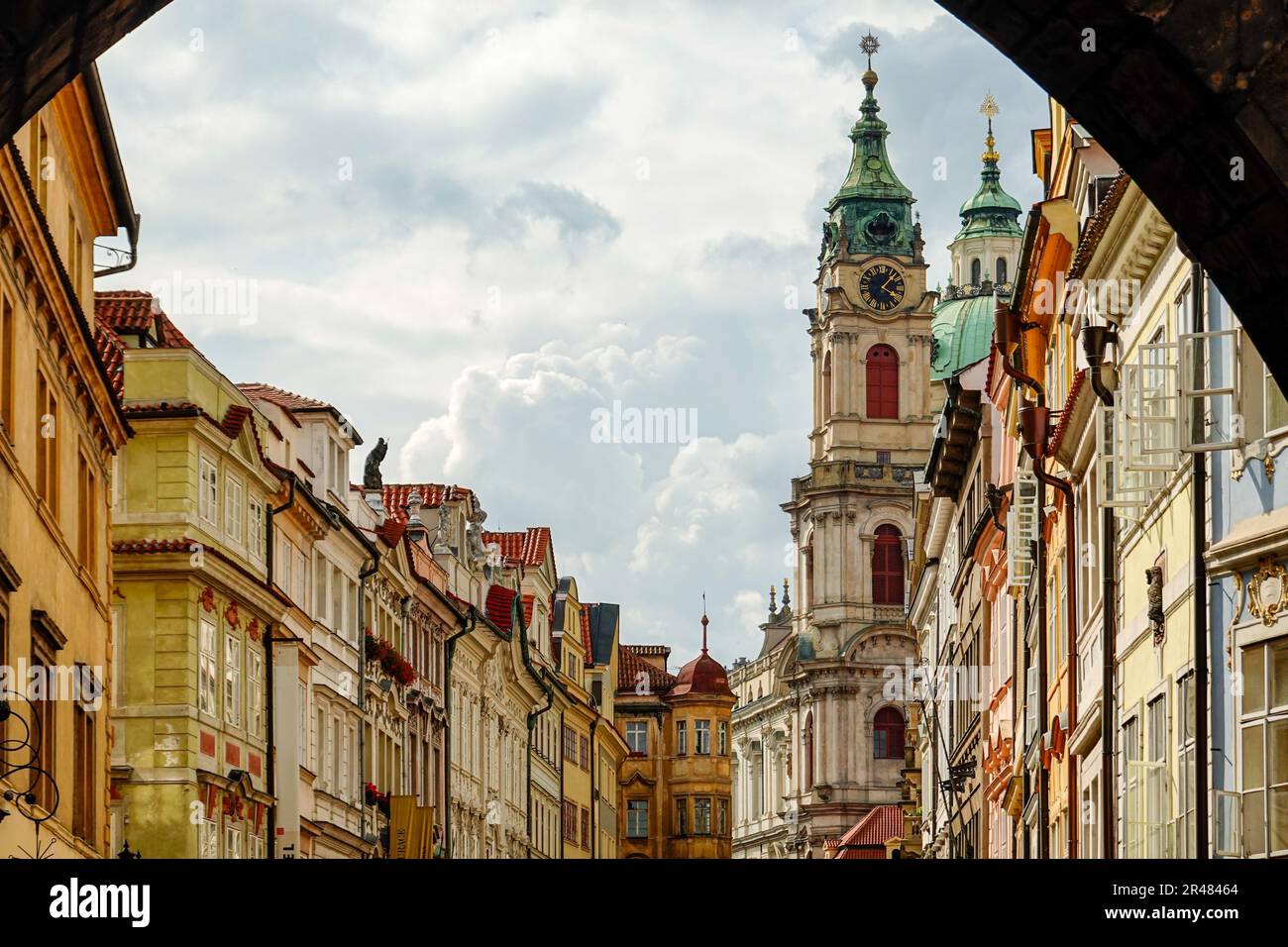 A picturesque street with vintage-style buildings and St. Nicholas ...