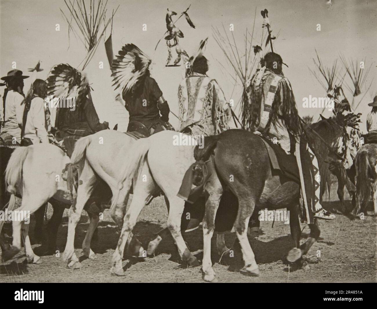 Untitled (Rear view of Native Americans riding Stock Photo - Alamy