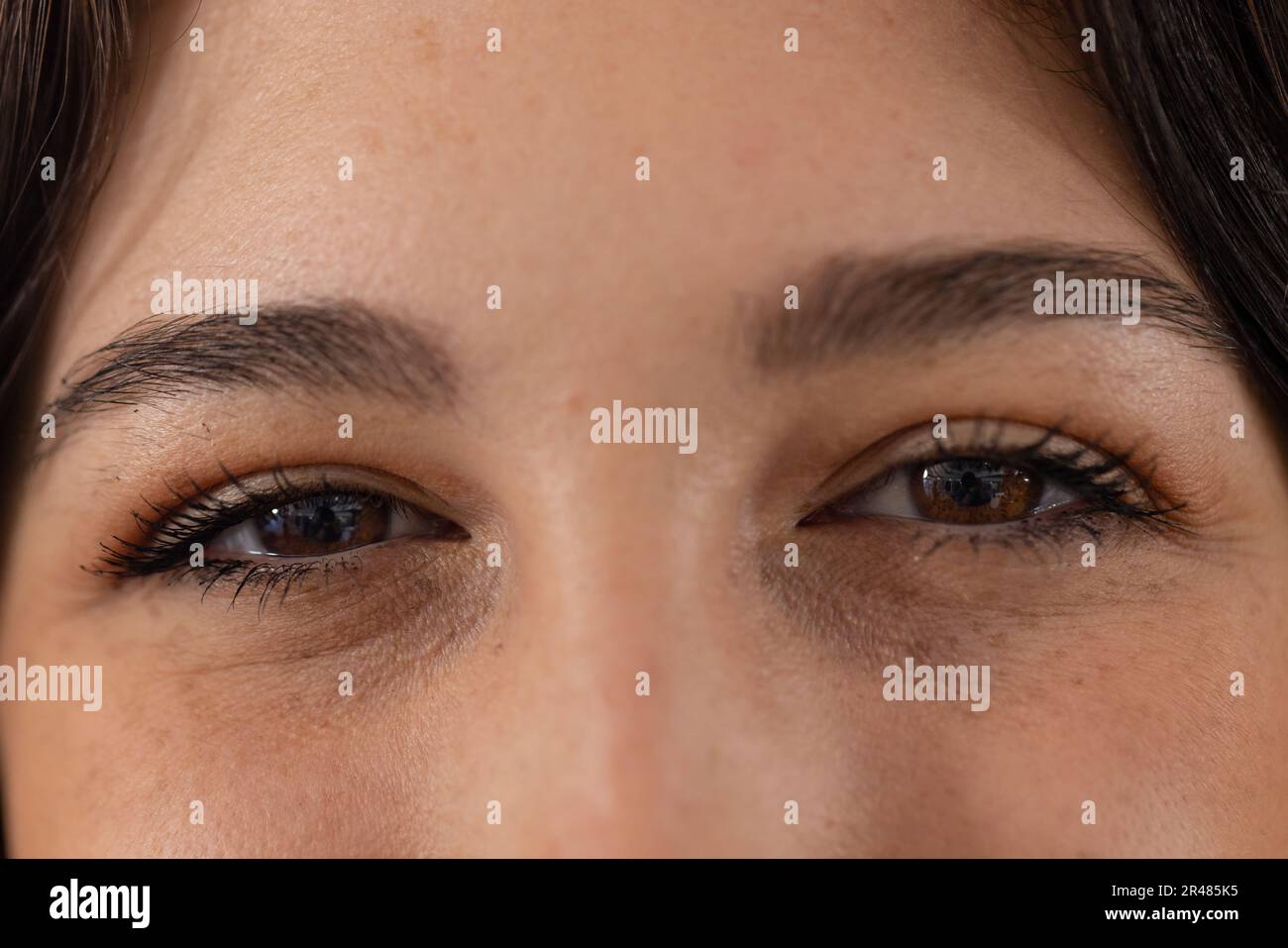 Portrait close up of brown eyes of happy caucasian female customer at ...