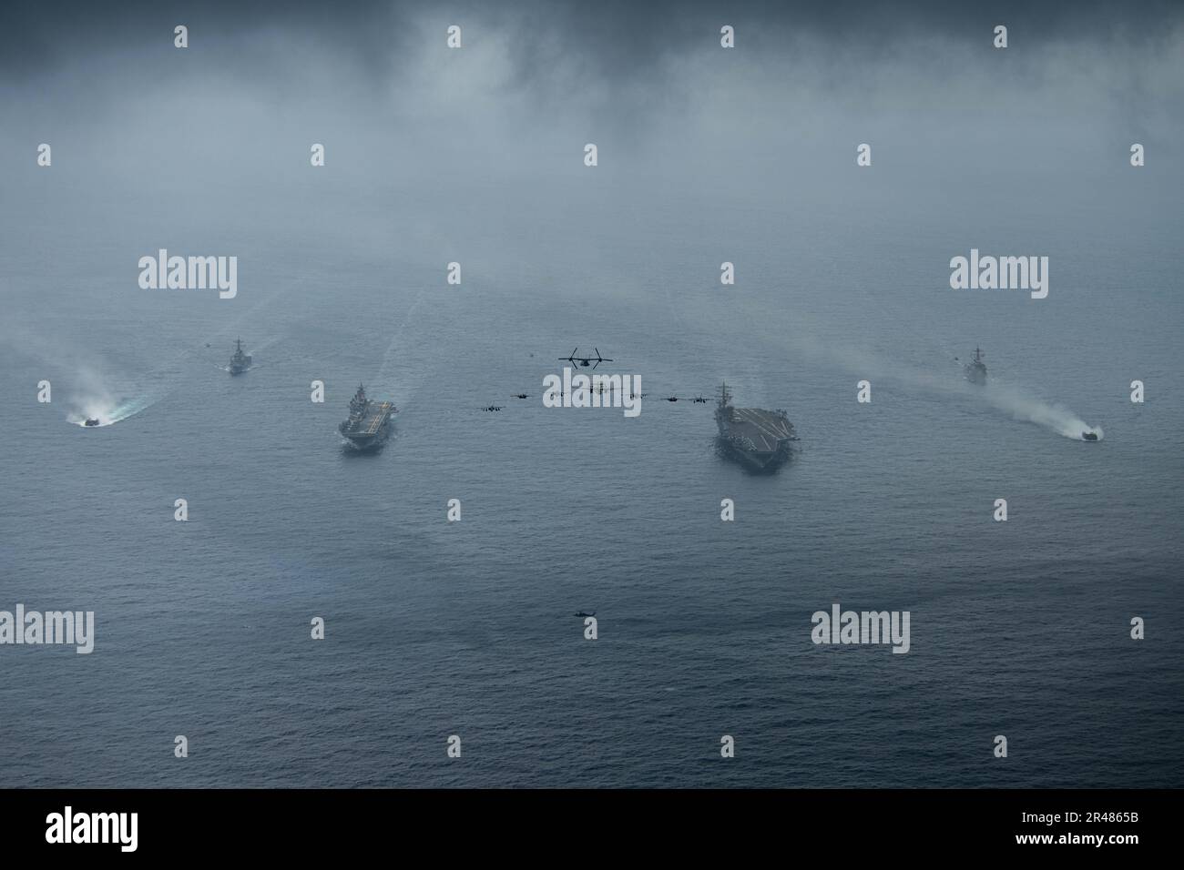 230215-N-ZQ263-1189 SOUTH CHINA SEA (Feb. 15, 2023) Ships and aircraft ...