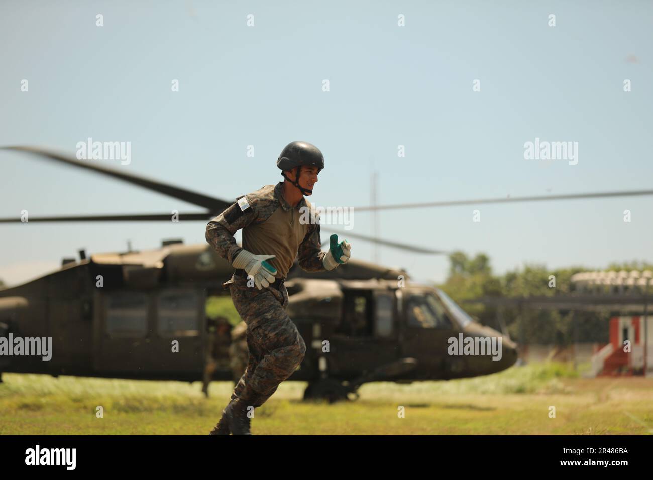 Guatemalan Naval Special Forces fast rope from a UH60 Blackhawk for ...