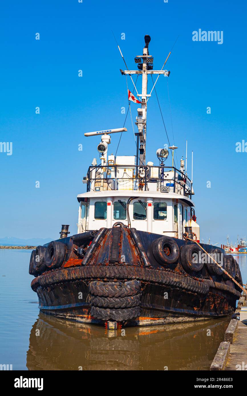 Bow of a tugboat docked along the Steveston waterfront in British ...