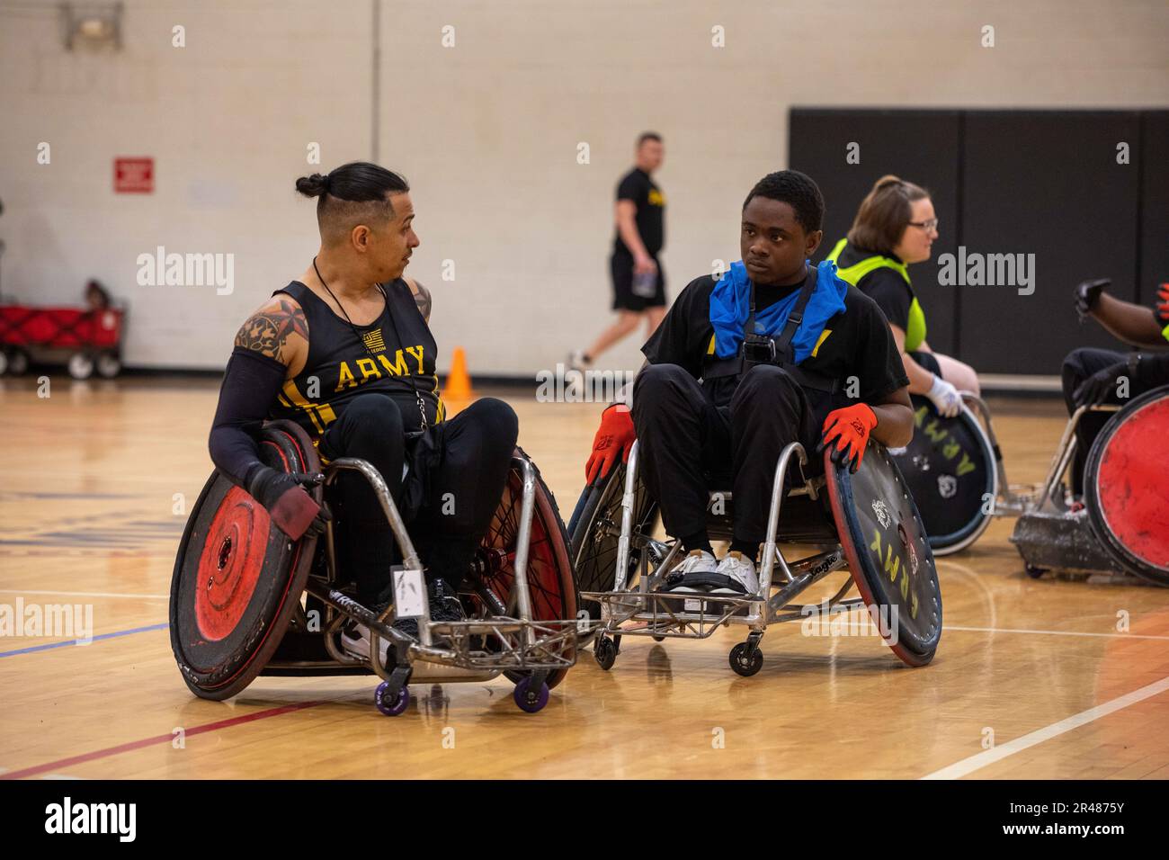 Retired U.S. Staff Sgt. Joel Rodriguez, left, Spc. Michael Raiford ...
