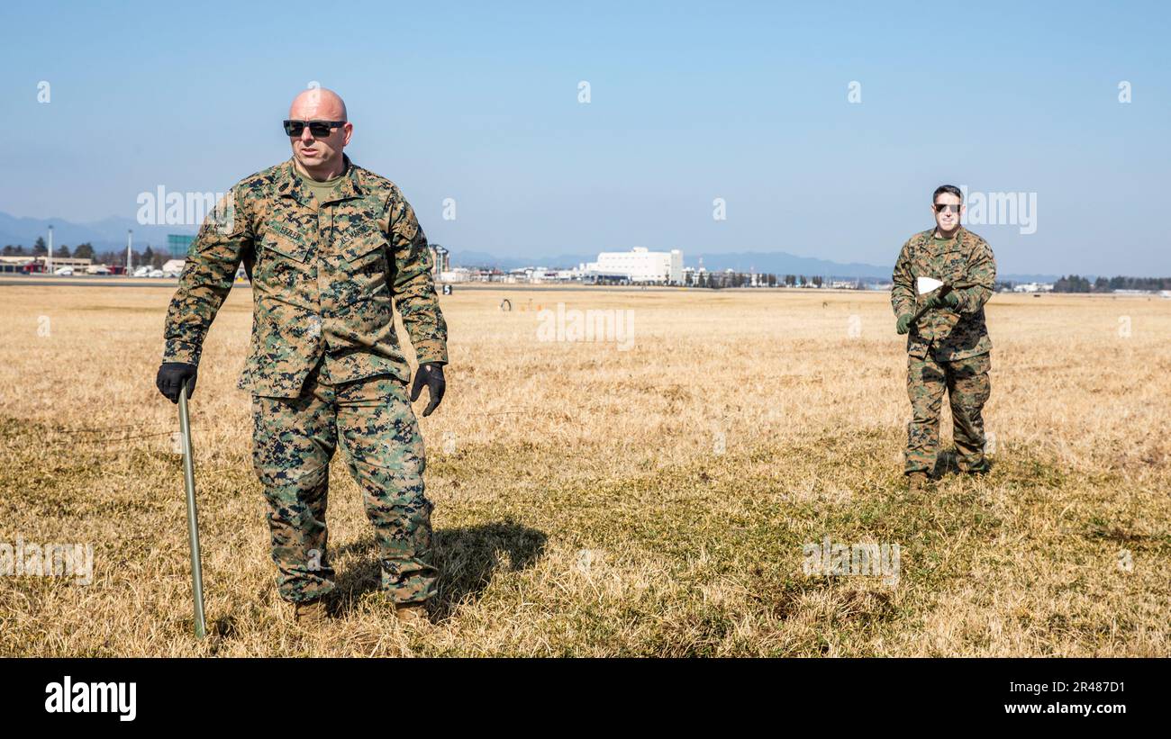 U.S. Marine Corps First Sgt. Robert Etzler, left, first sergeant of ...
