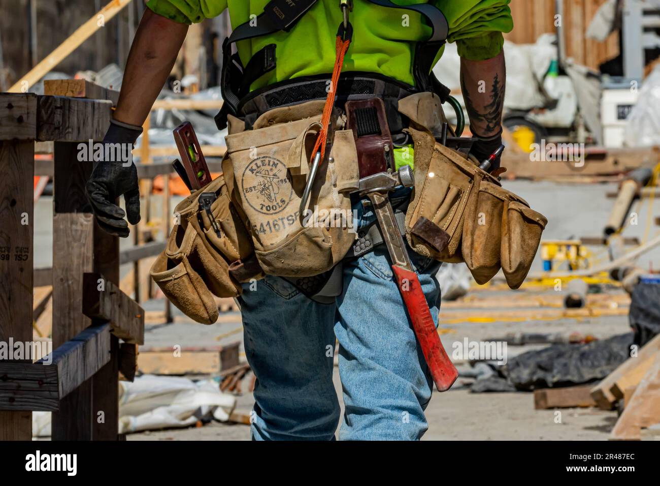 Construction laborers perform work on the chamber floor concrete infill ...