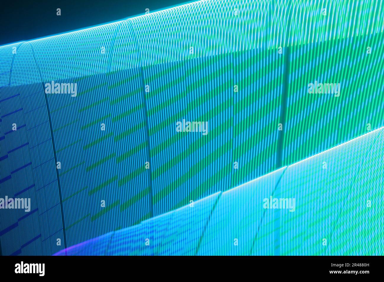 A large display featuring a pattern of blue lights radiating outward ...