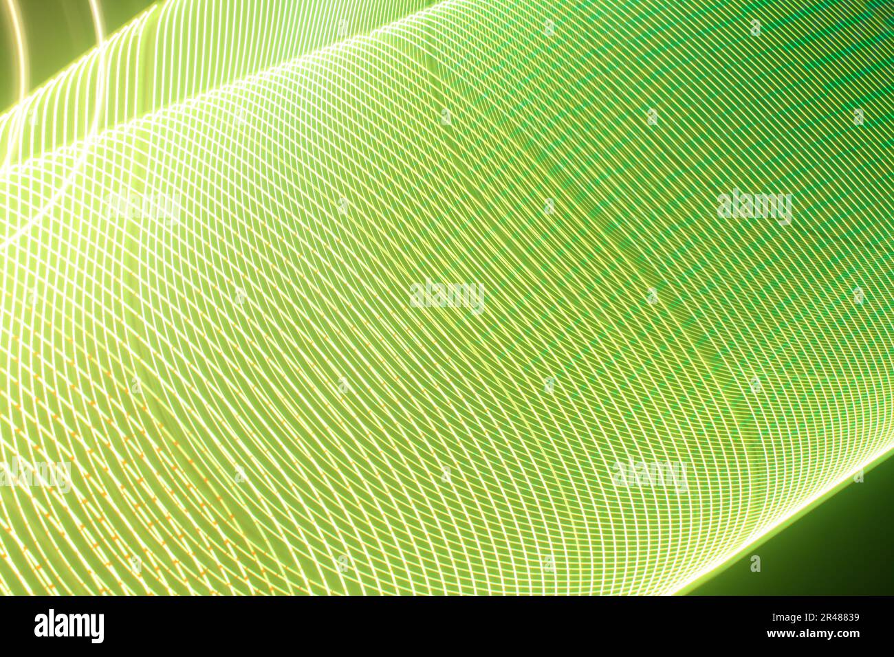 A large display featuring a pattern of green lights radiating outward ...