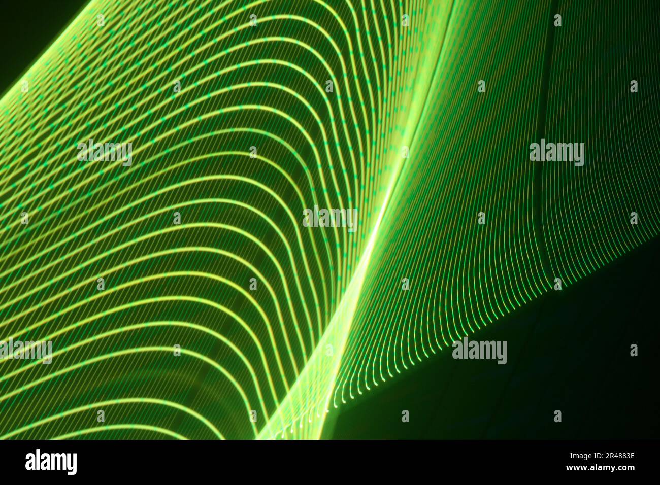 A large display featuring a pattern of green lights radiating outward ...