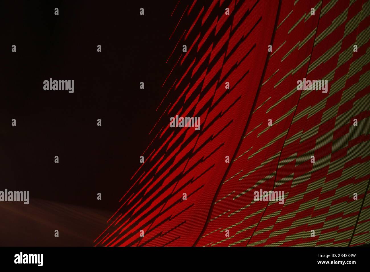A large display featuring a pattern of red lights radiating outward ...