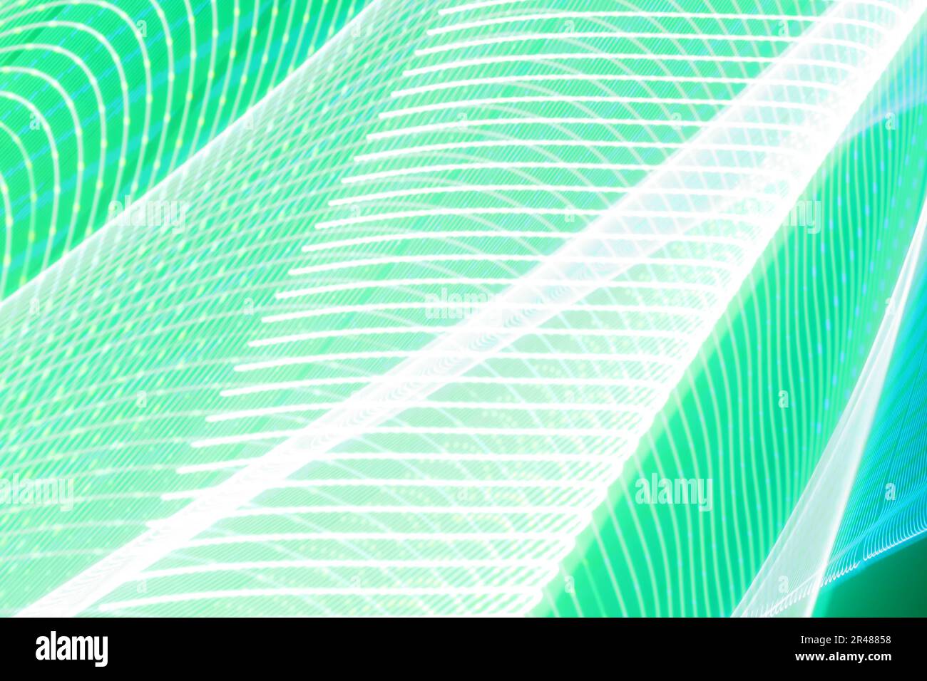 A large display featuring a pattern of green lights radiating outward ...