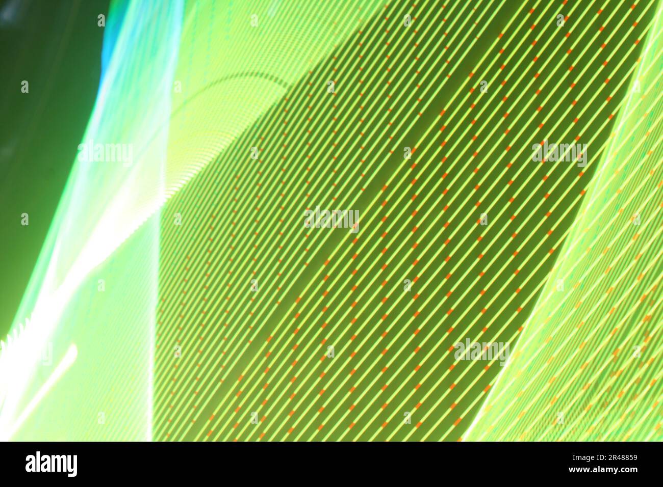 A large display featuring a pattern of green lights radiating outward ...