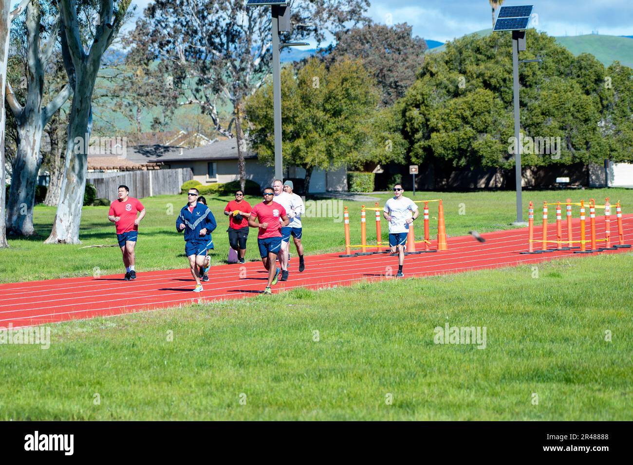 U.S. Airmen and family members participate in a warrior fun run ...