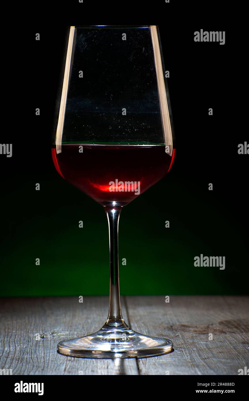 Glass of red wine on the table Stock Photo - Alamy