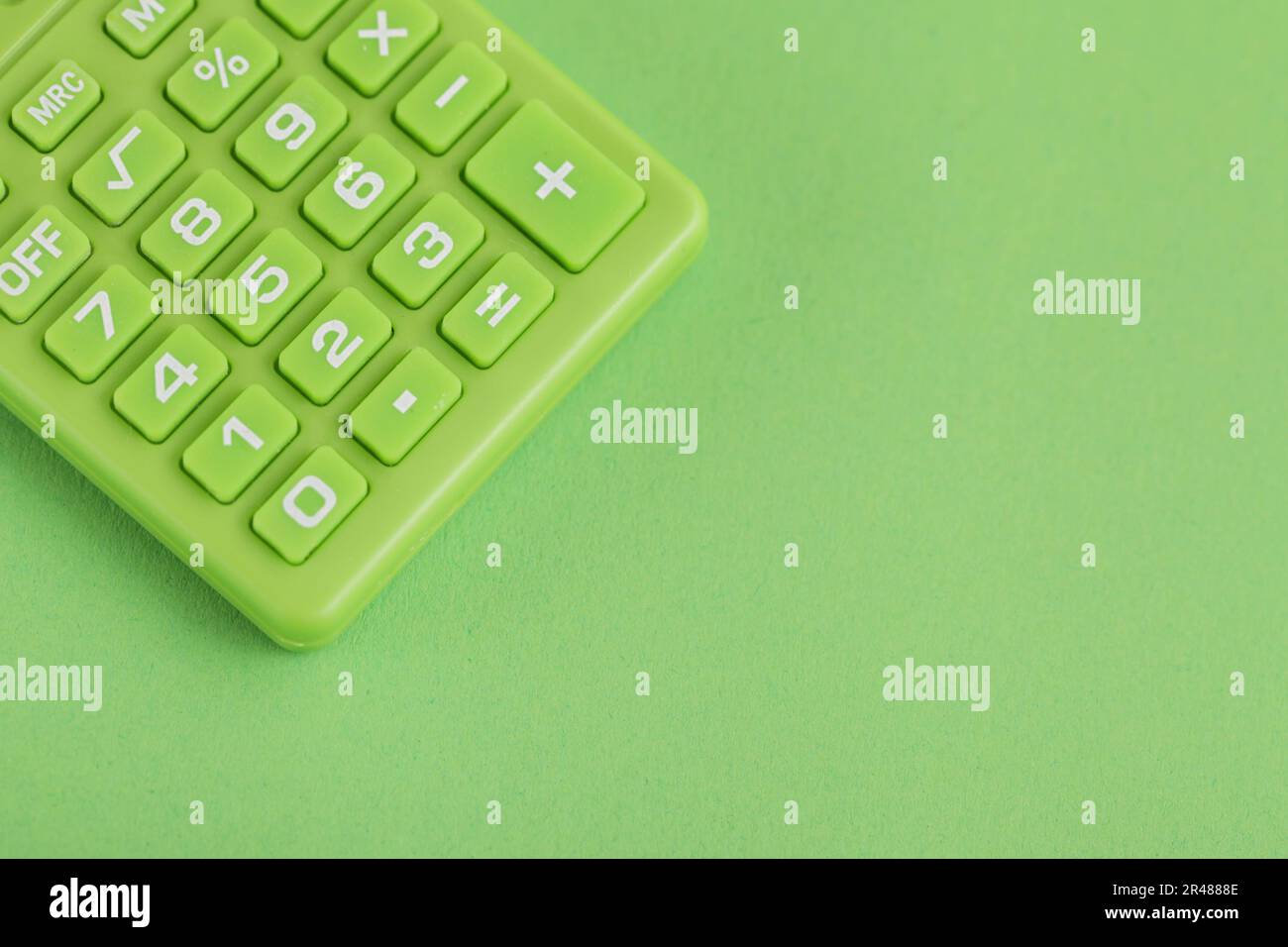Green calculator on Green background. Copy space. Environmental, Social ...