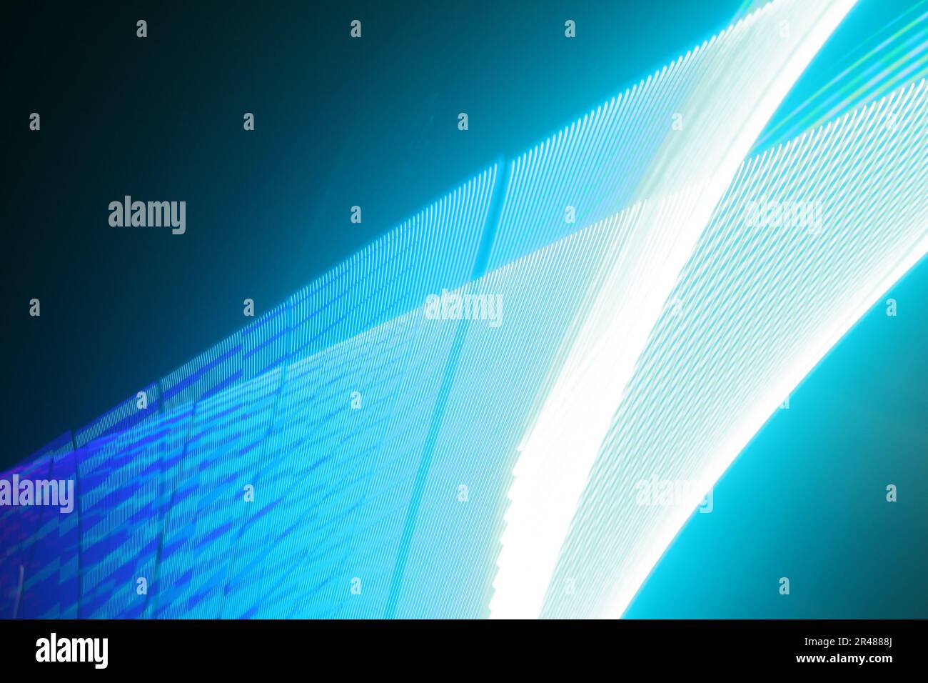 A large display featuring a pattern of blue lights radiating outward ...