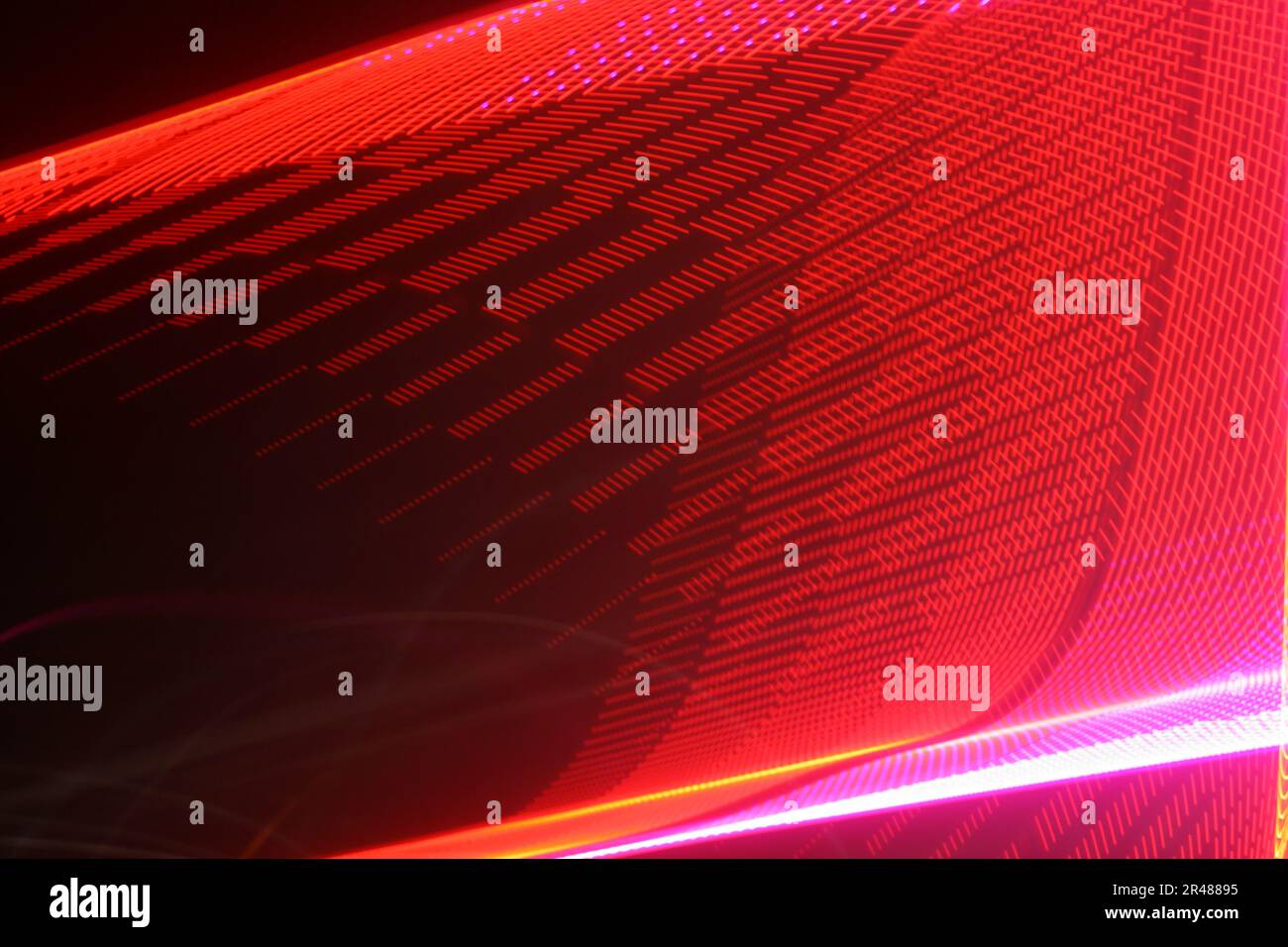 A large display featuring a pattern of red lights radiating outward ...