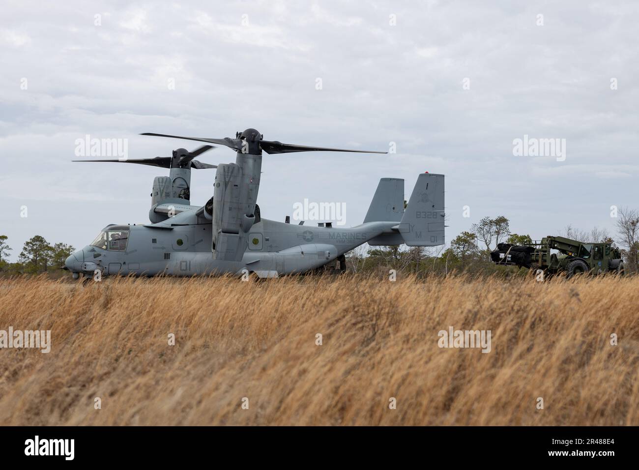 U.S. Marines with 2nd Marine Aircraft Wing (MAW) unload equipment from ...